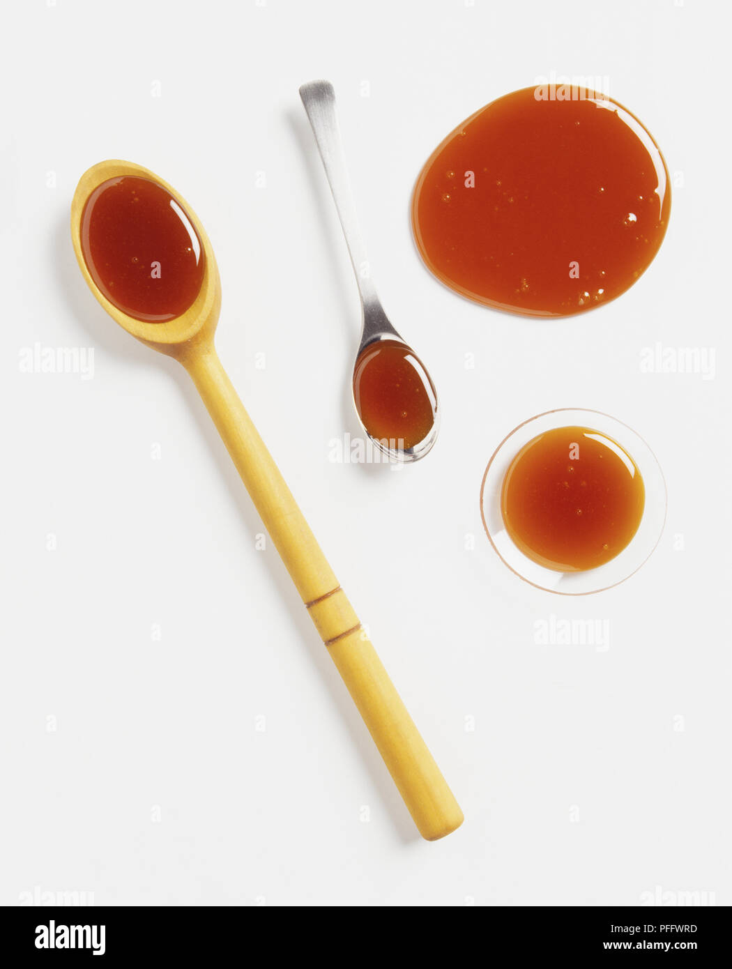Two spoons, a small bowl and a blob of malt Stock Photo - Alamy