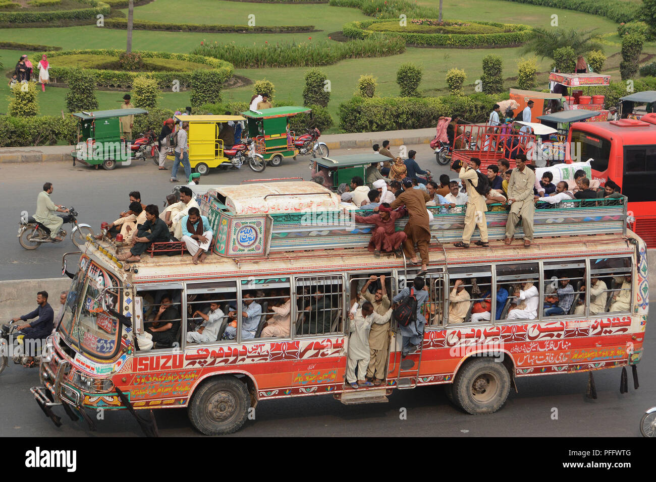 Pakistani passengers travel on a overcrowded bus to reach their ...