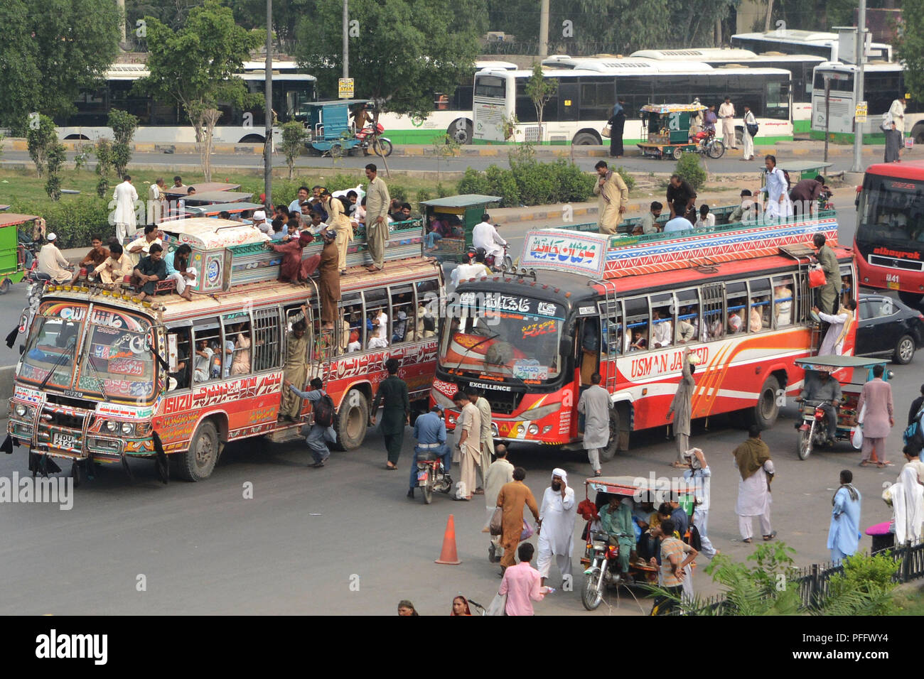 Pakistani passengers travel on a overcrowded bus to reach their ...