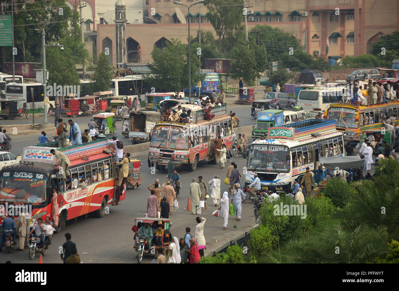 Pakistani passengers travel on a overcrowded bus to reach their ...