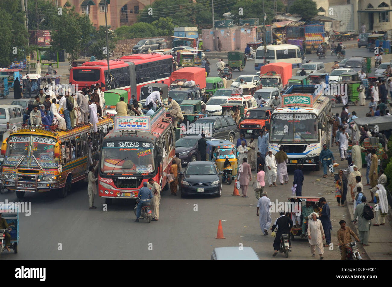 Pakistani passengers travel on a overcrowded bus to reach their ...