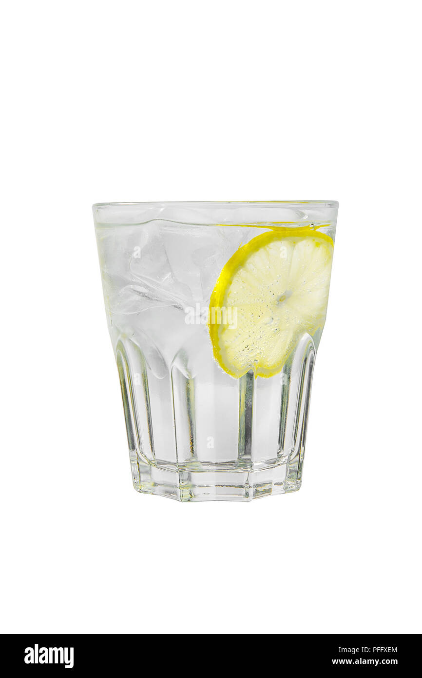 Transparent cocktail, refreshing water in a low glass with ice cubes and a round slice of lemon ...