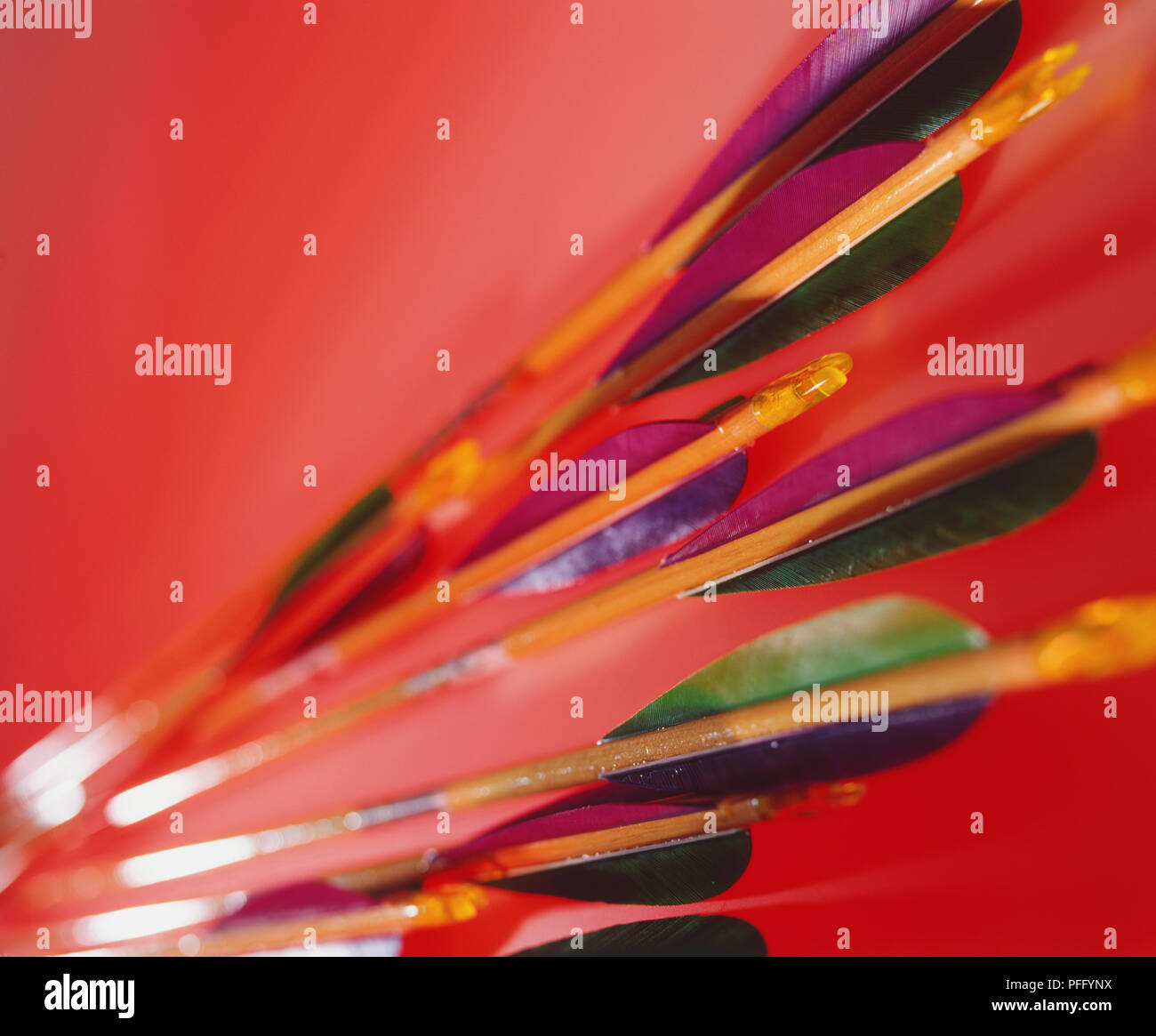 Colourful fletches on arrow tails, close up Stock Photo - Alamy