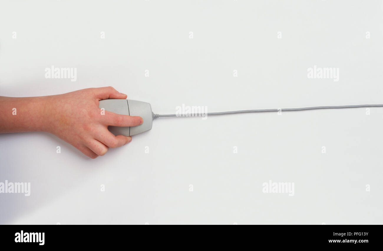 Hand holding computer mouse Stock Photo - Alamy