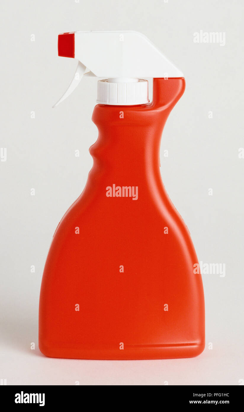 A red plastic spray bottle, side view Stock Photo - Alamy
