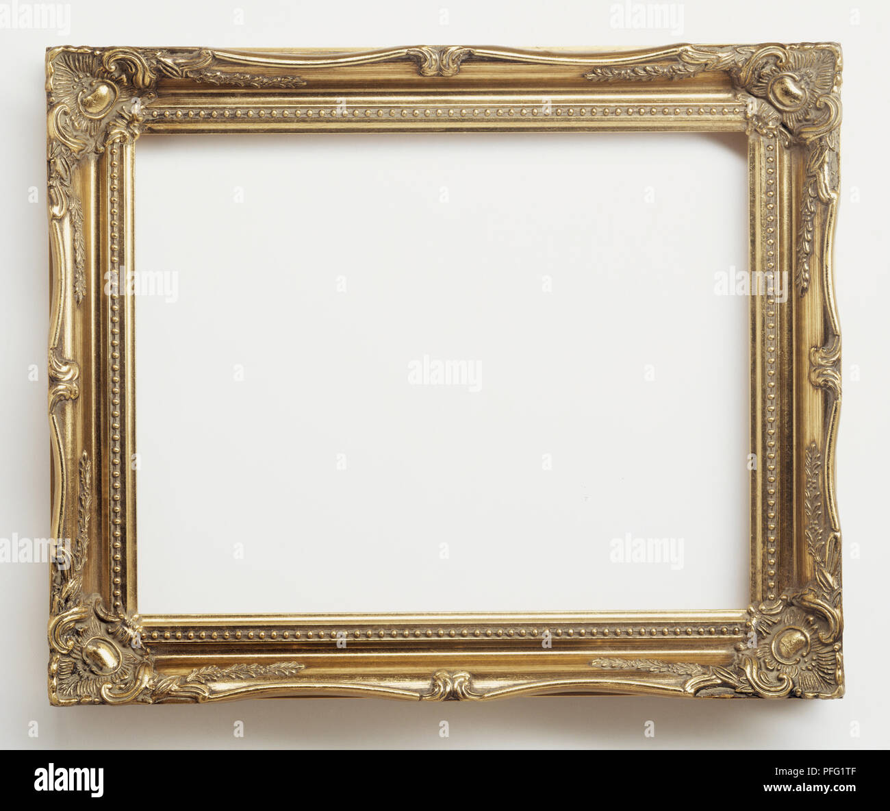 Golden Frame with ornate engravings Stock Photo - Alamy