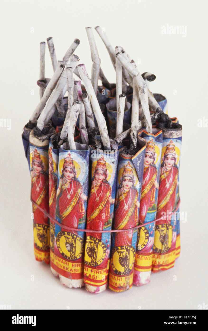 Indian colourful cylindrical fireworks in a bunch with white wicks ...