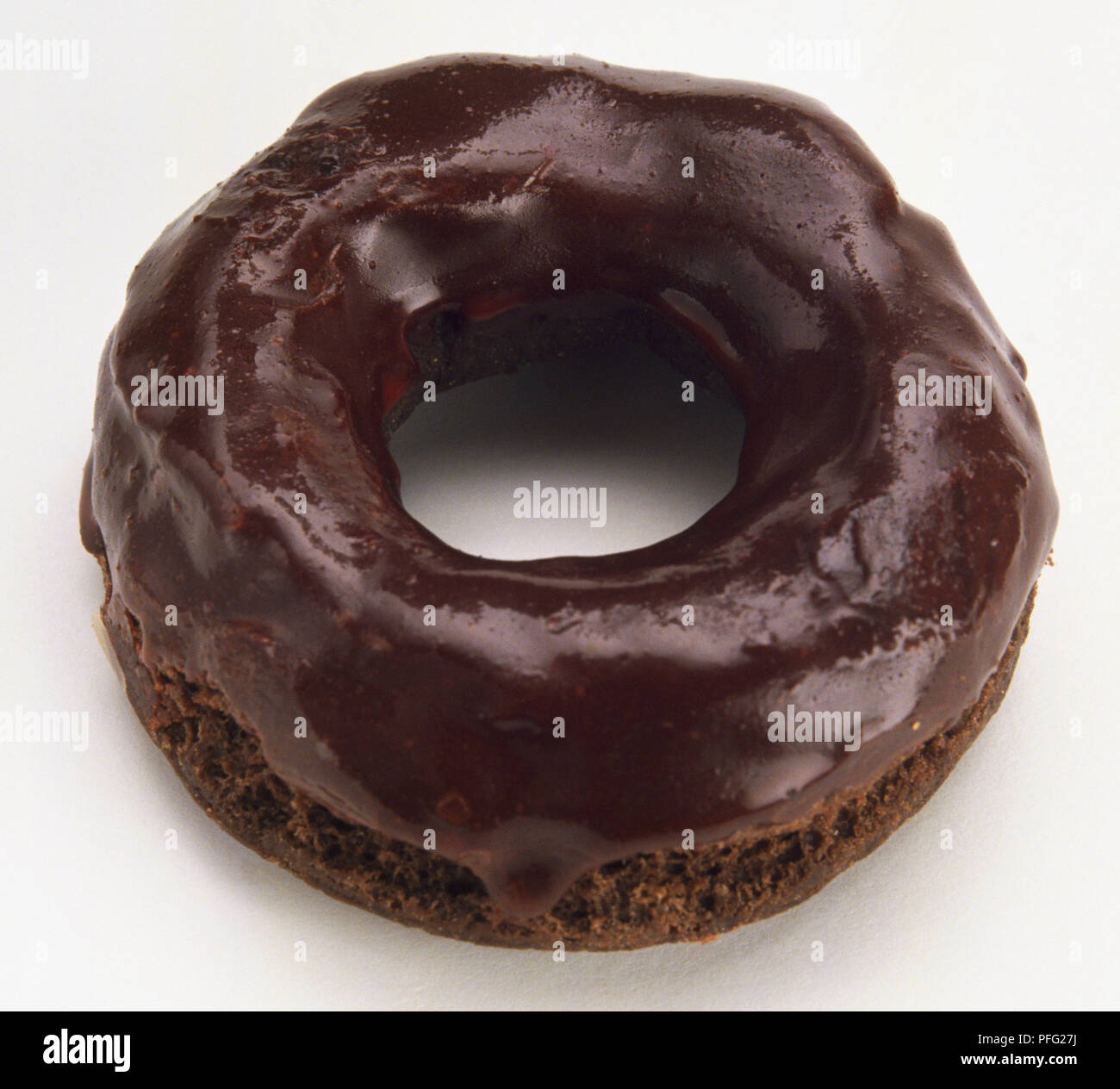 Chocolate covered ring doughnut Stock Photo - Alamy