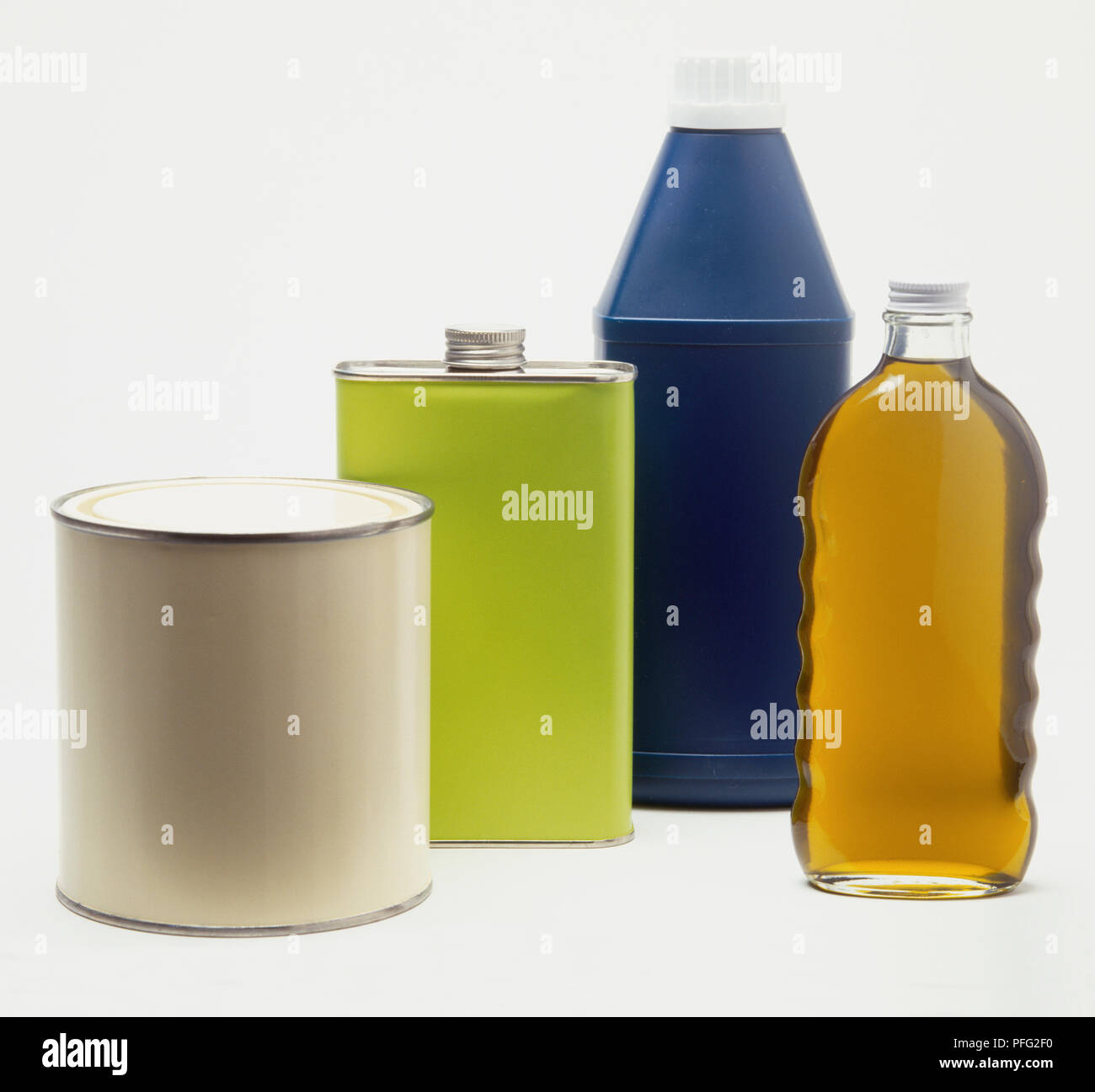 Unlabelled cans and plastic containers of different colours and shapes ...