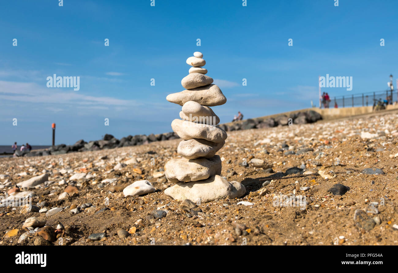 White stones balancing on a beach Stock Photo - Alamy