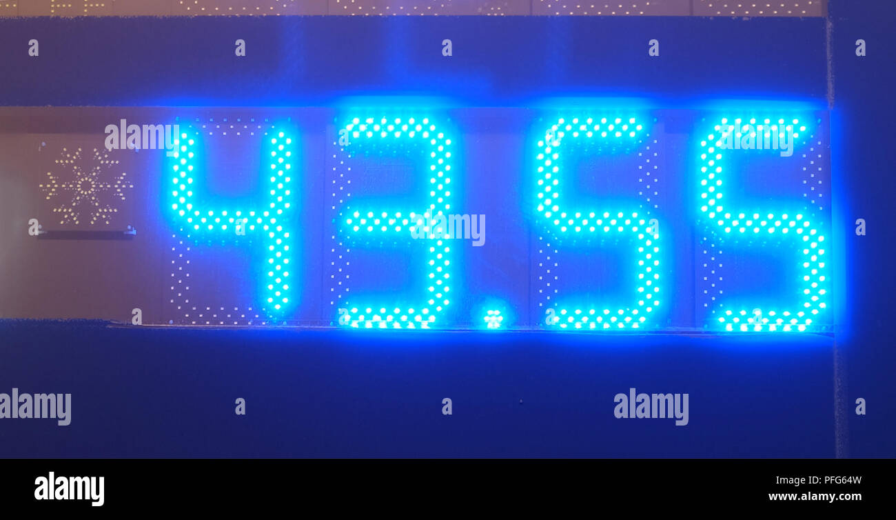 The neon blue numbers on the electronic scoreboard. Luminescent glow ...