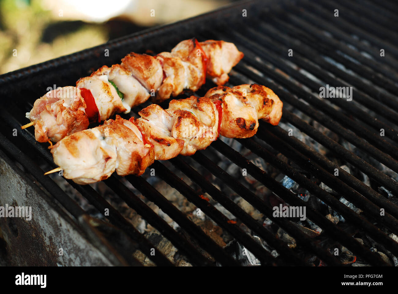 Barbeque meat roasting on grill Stock Photo - Alamy