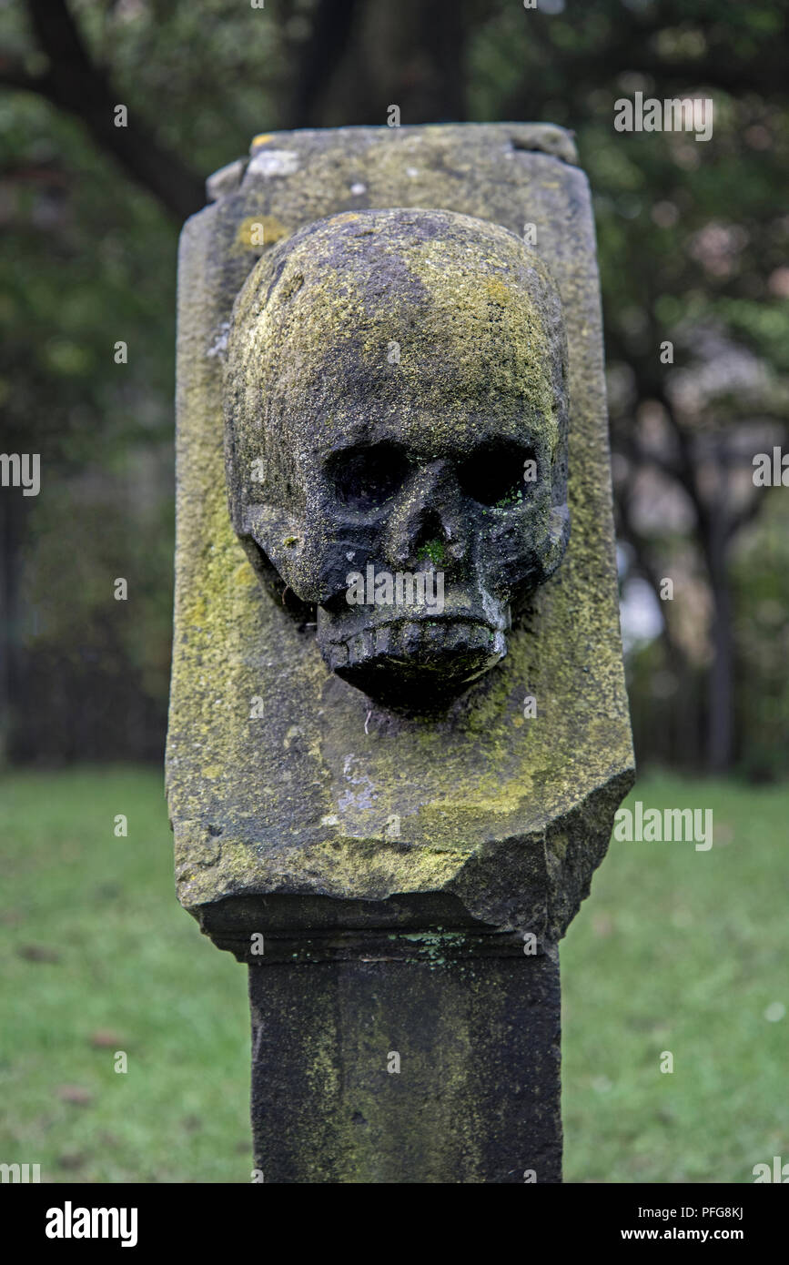 A carved skull on the side of a headstone in North Leith Burial Ground ...