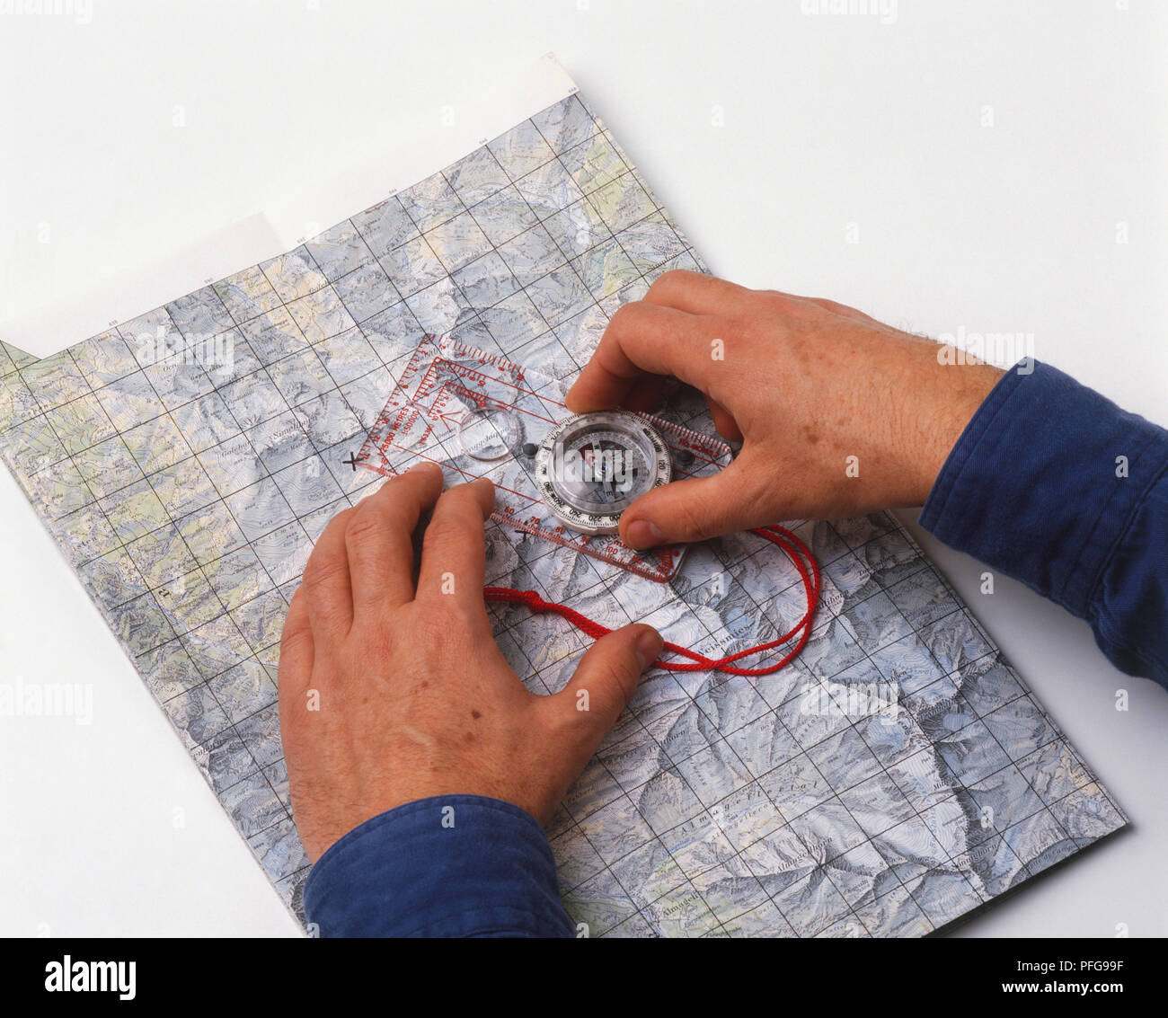 Man using Compass on Map Stock Photo - Alamy