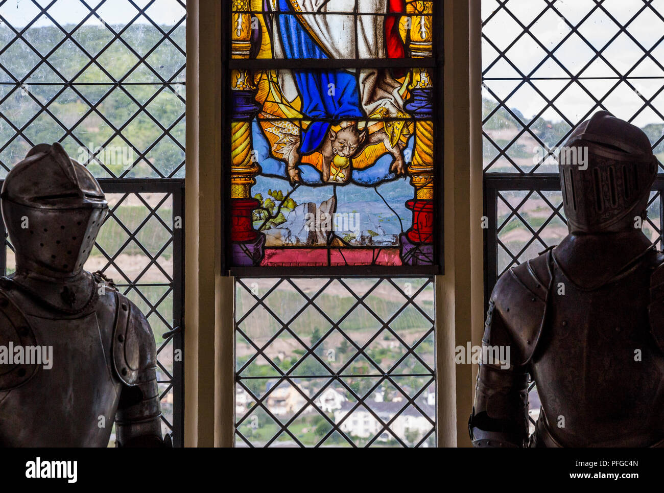 Suits of armour and a stained glass window at Burg Rheinstein on the ...