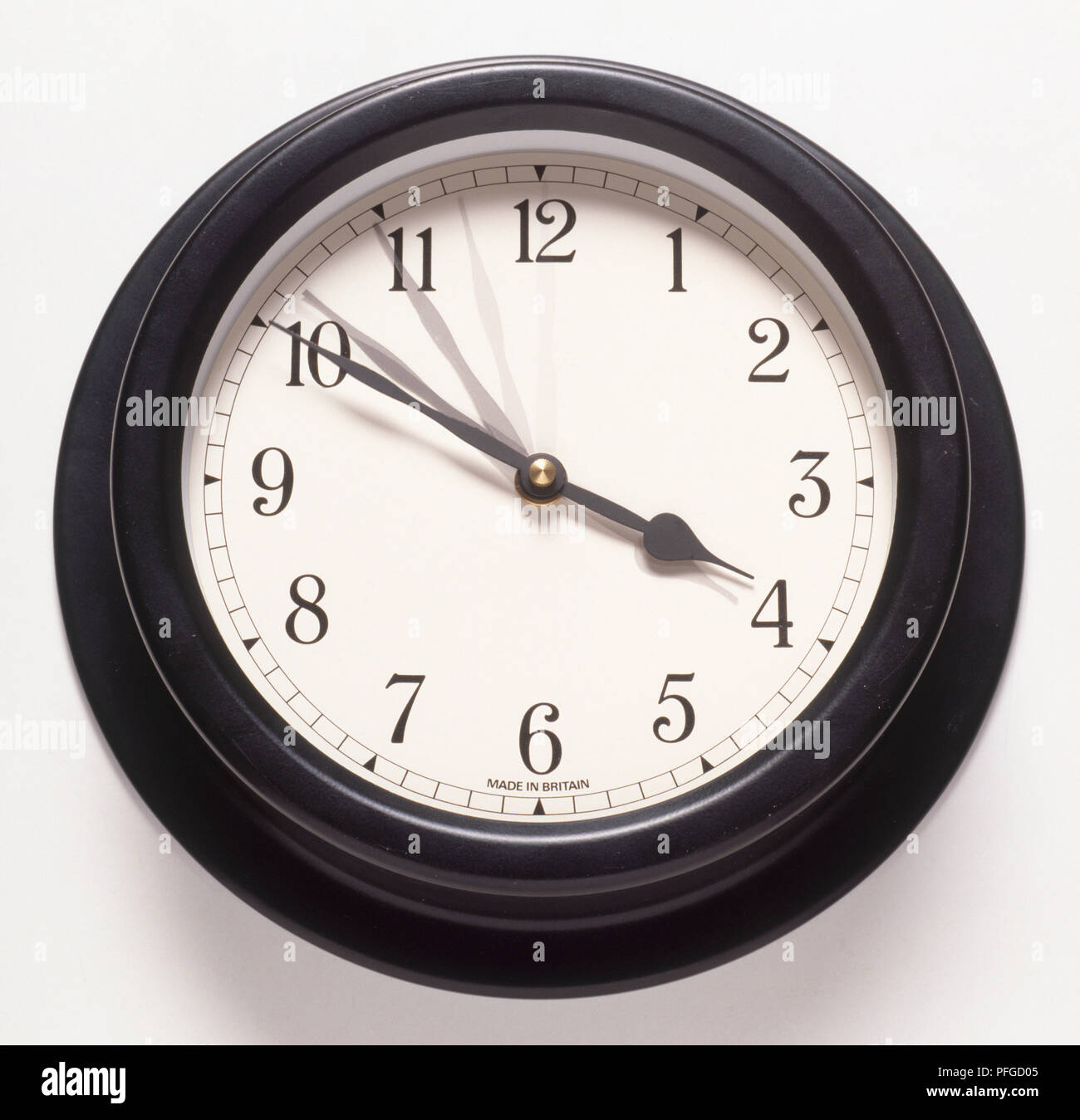 Clock with moving hands Stock Photo - Alamy