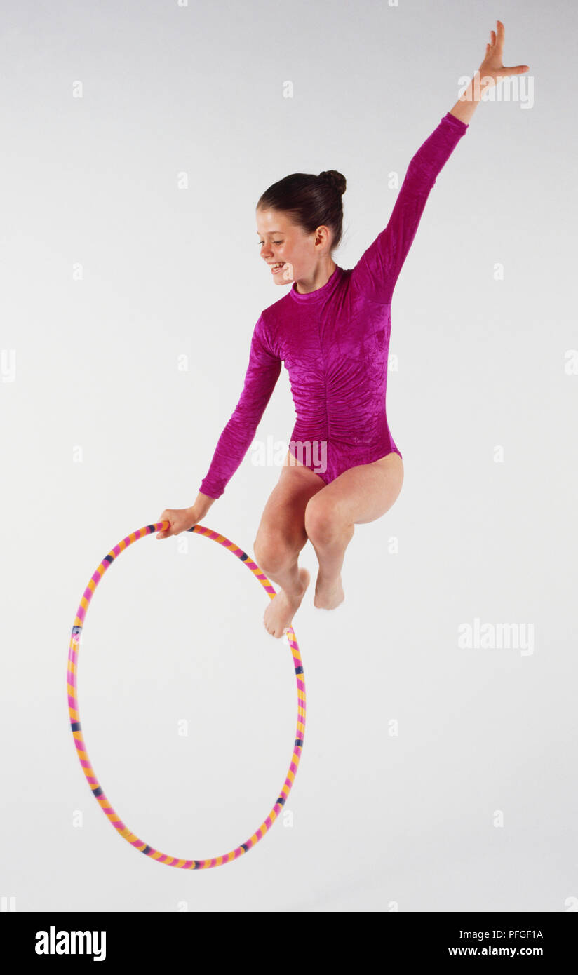 Jumping through the hoop Stock Photo - Alamy