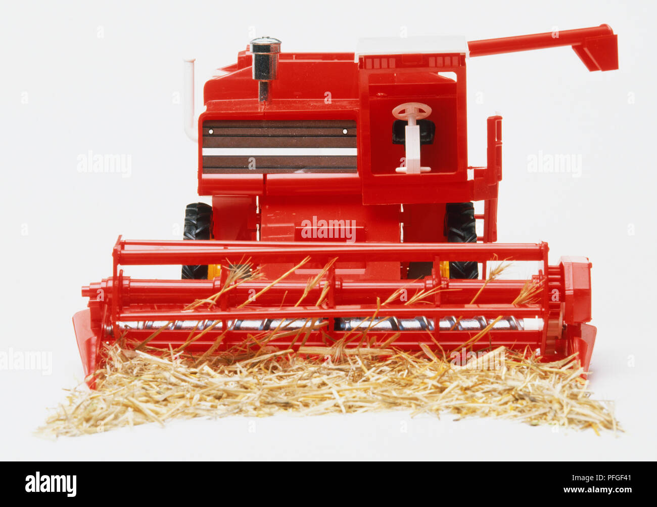 Red toy combine harvester, close up Stock Photo - Alamy