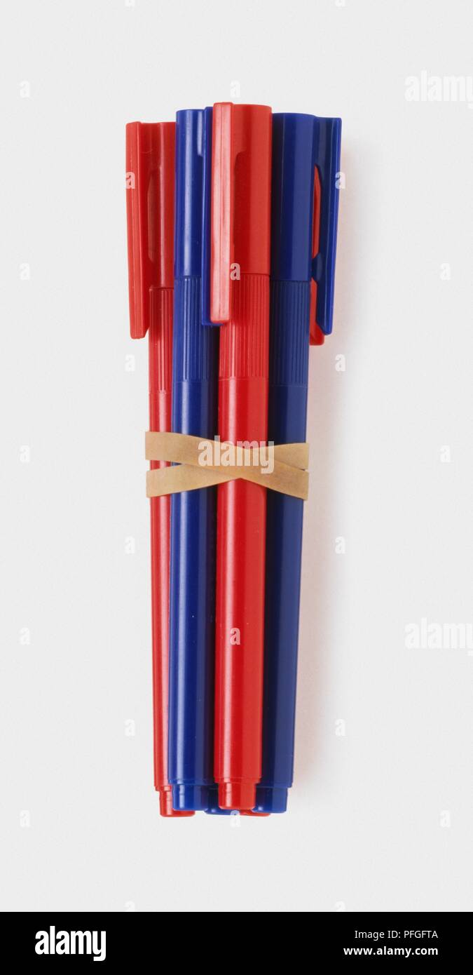 Rubber band around bundle of red and blue felt tip pens Stock Photo - Alamy