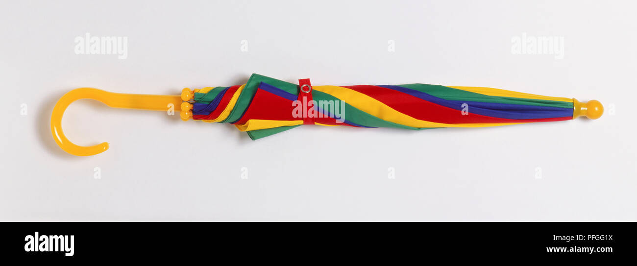 Closed multi-coloured umbrella, side view Stock Photo - Alamy