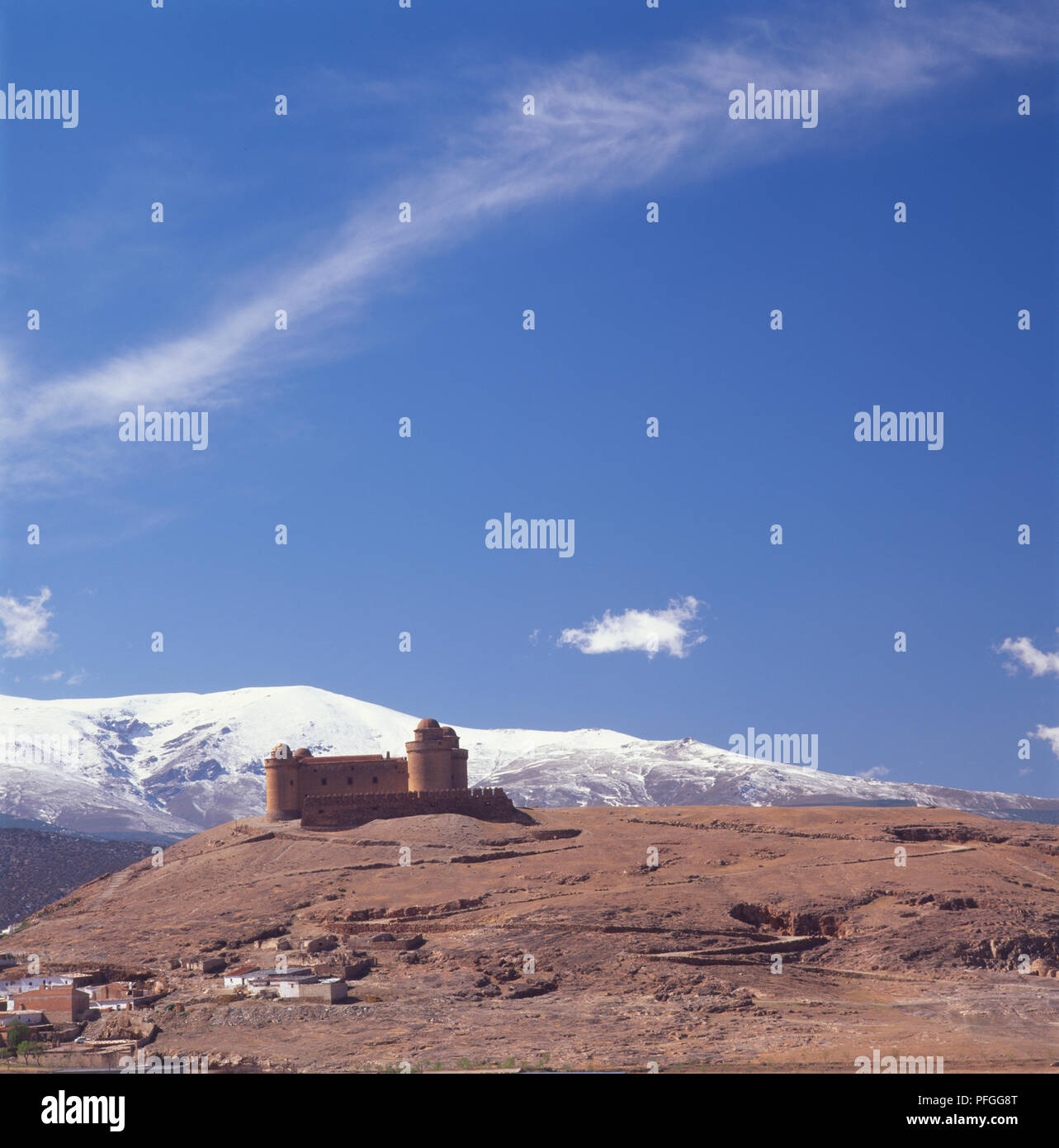 Spain, Andalusia, Renaissance castle with round domed turrets on barren ...