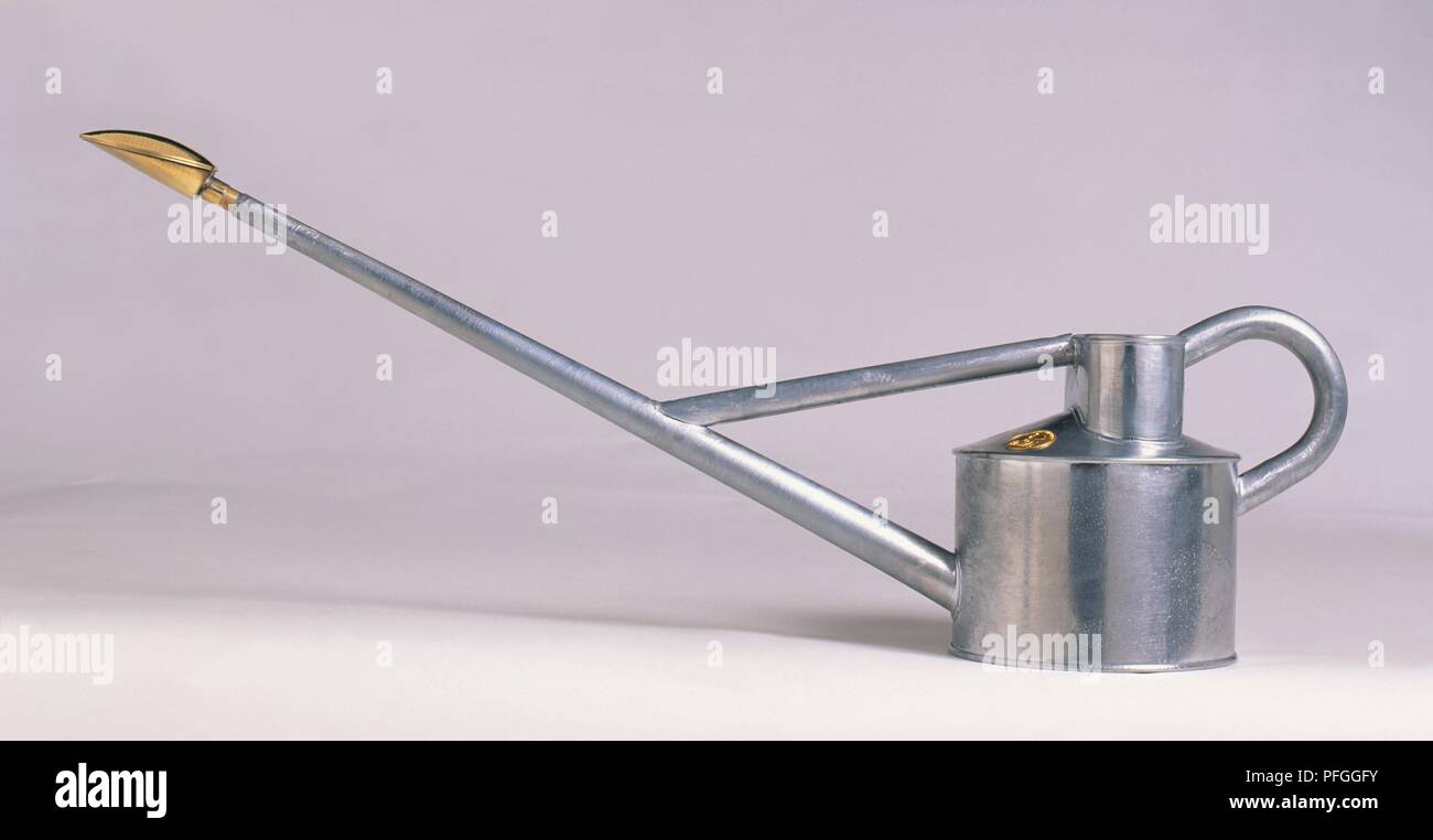 Long-reach, metal watering can, side view Stock Photo - Alamy