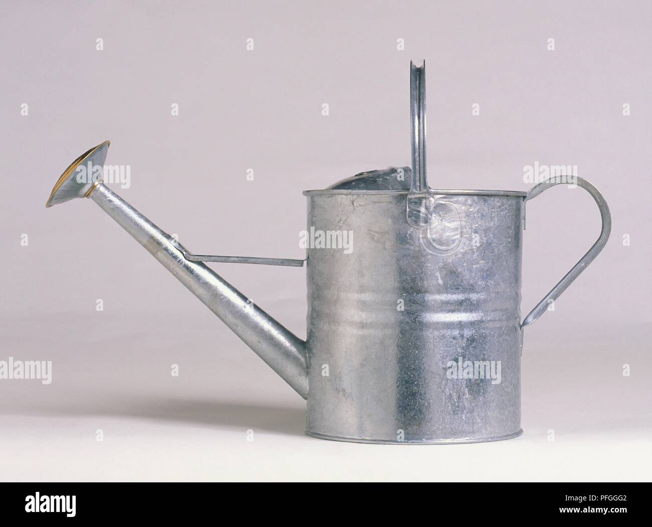 Metal watering can, side view Stock Photo - Alamy