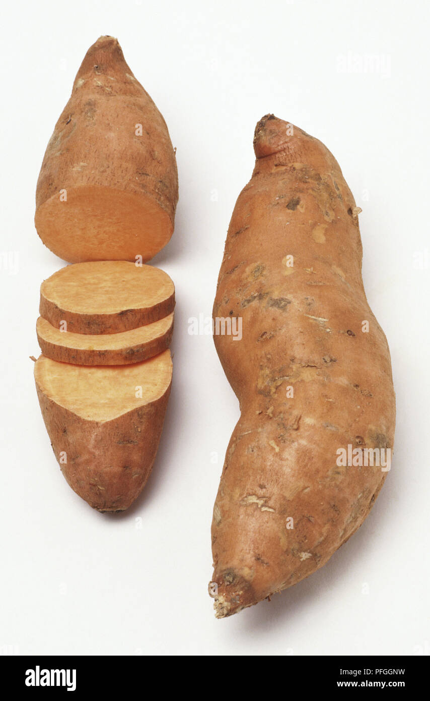 Sweet potatoes, whole and sliced Stock Photo - Alamy