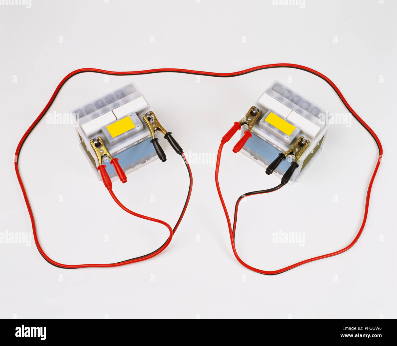 Two car batteries attached by jump leads Stock Photo - Alamy