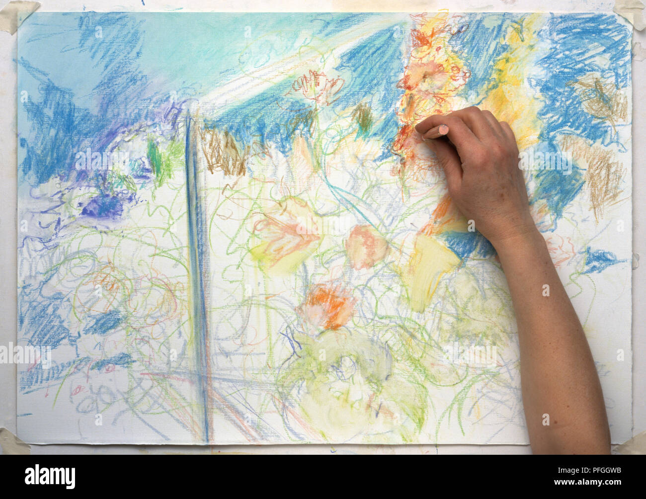 Hand using pastel to colour picture, close-up Stock Photo - Alamy