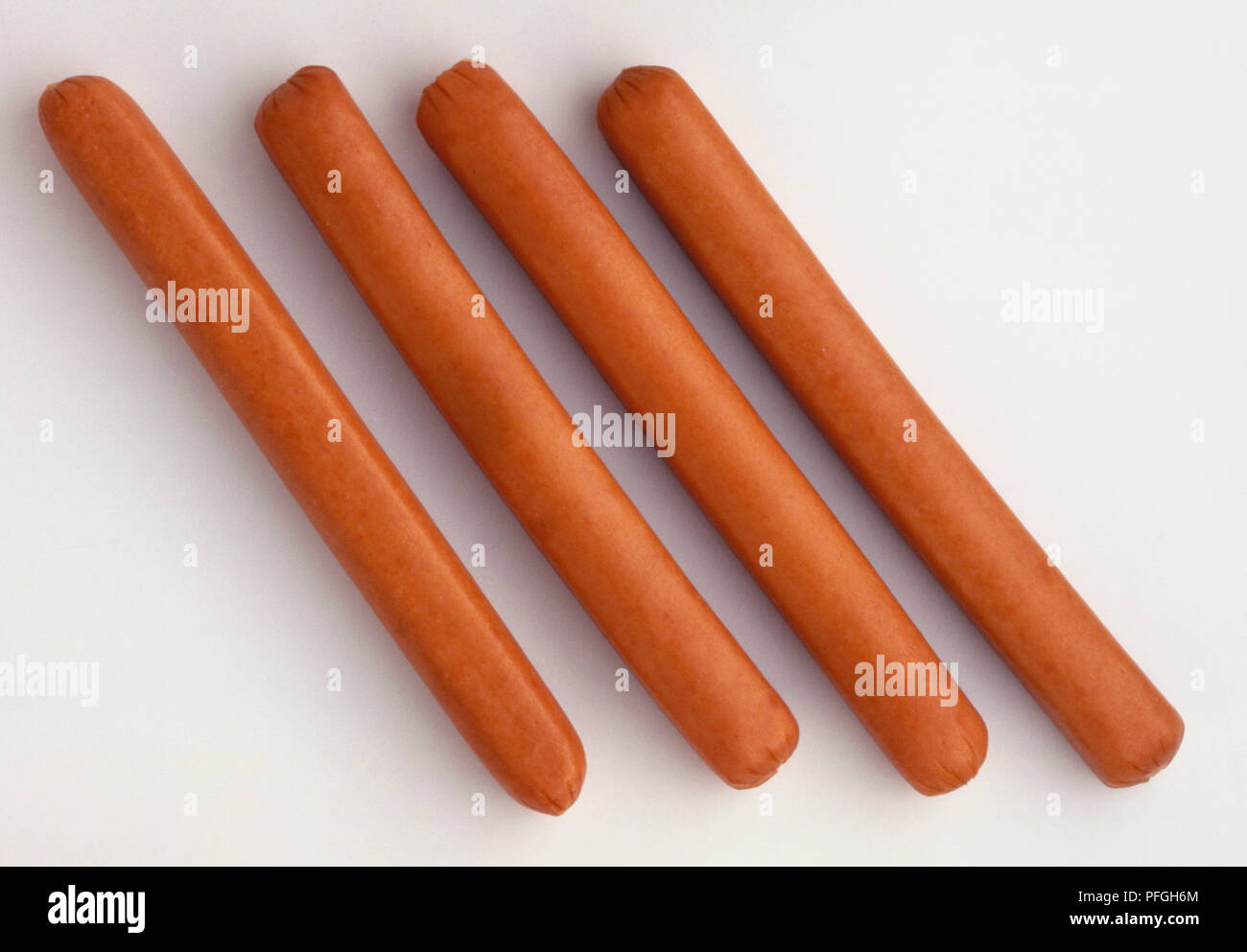 Above view of four frankfurter sausages Stock Photo - Alamy