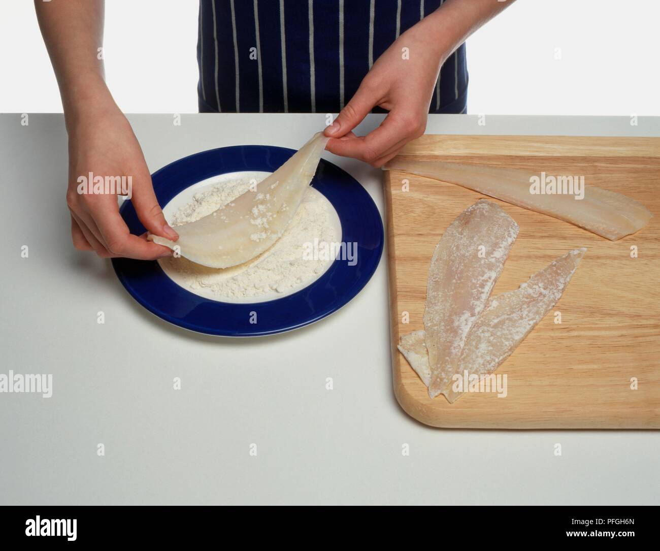 Turning the fish in flour hi-res stock photography and images - Alamy