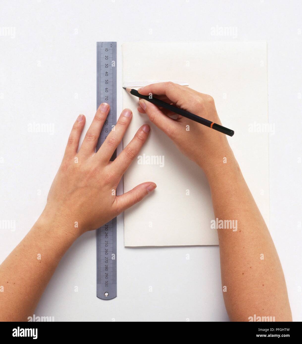 Making a sketchbook, marking width of binding tape using ruler and ...