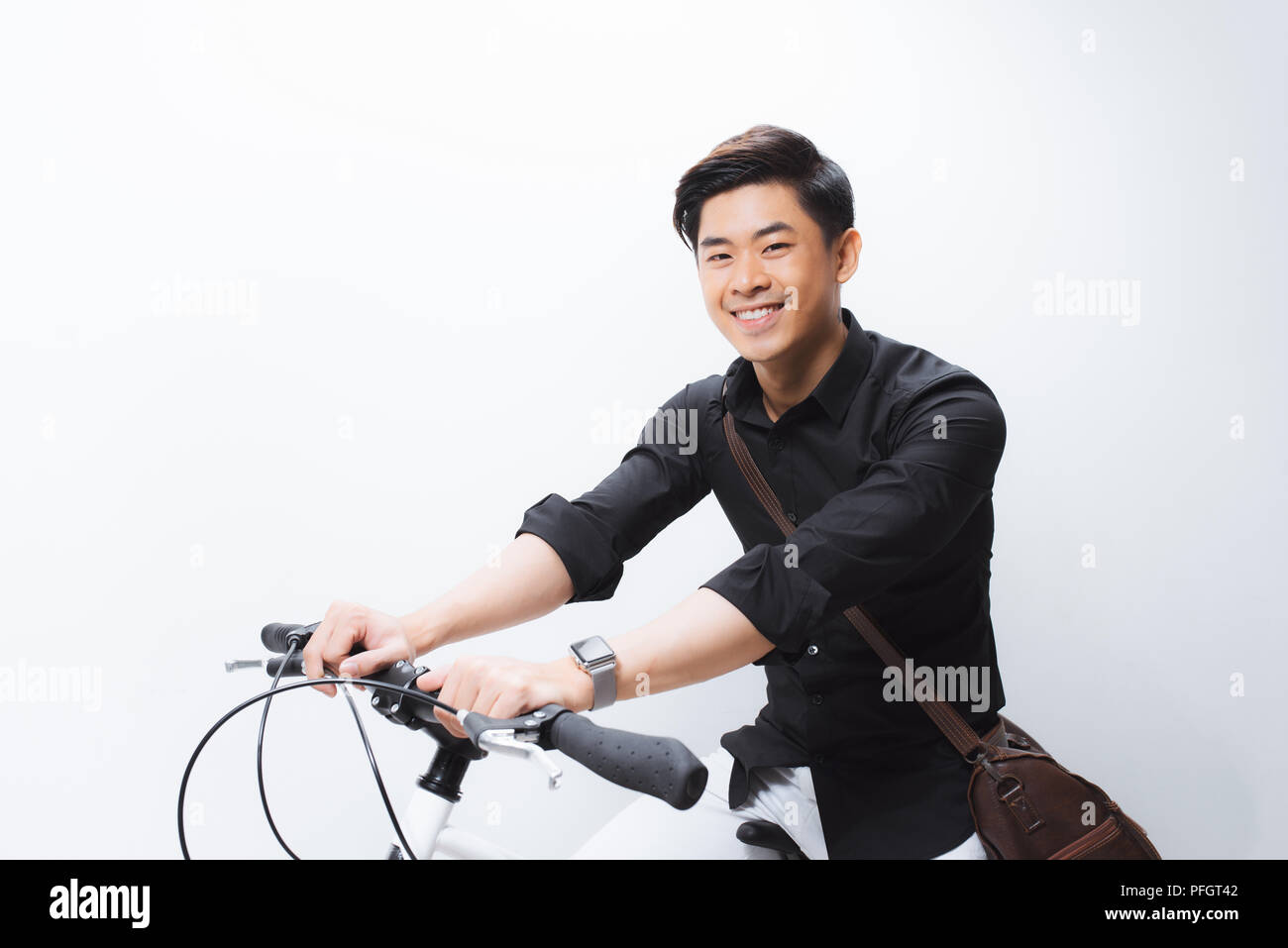 Handsome guy standing by bicycle isolated on white Stock Photo - Alamy