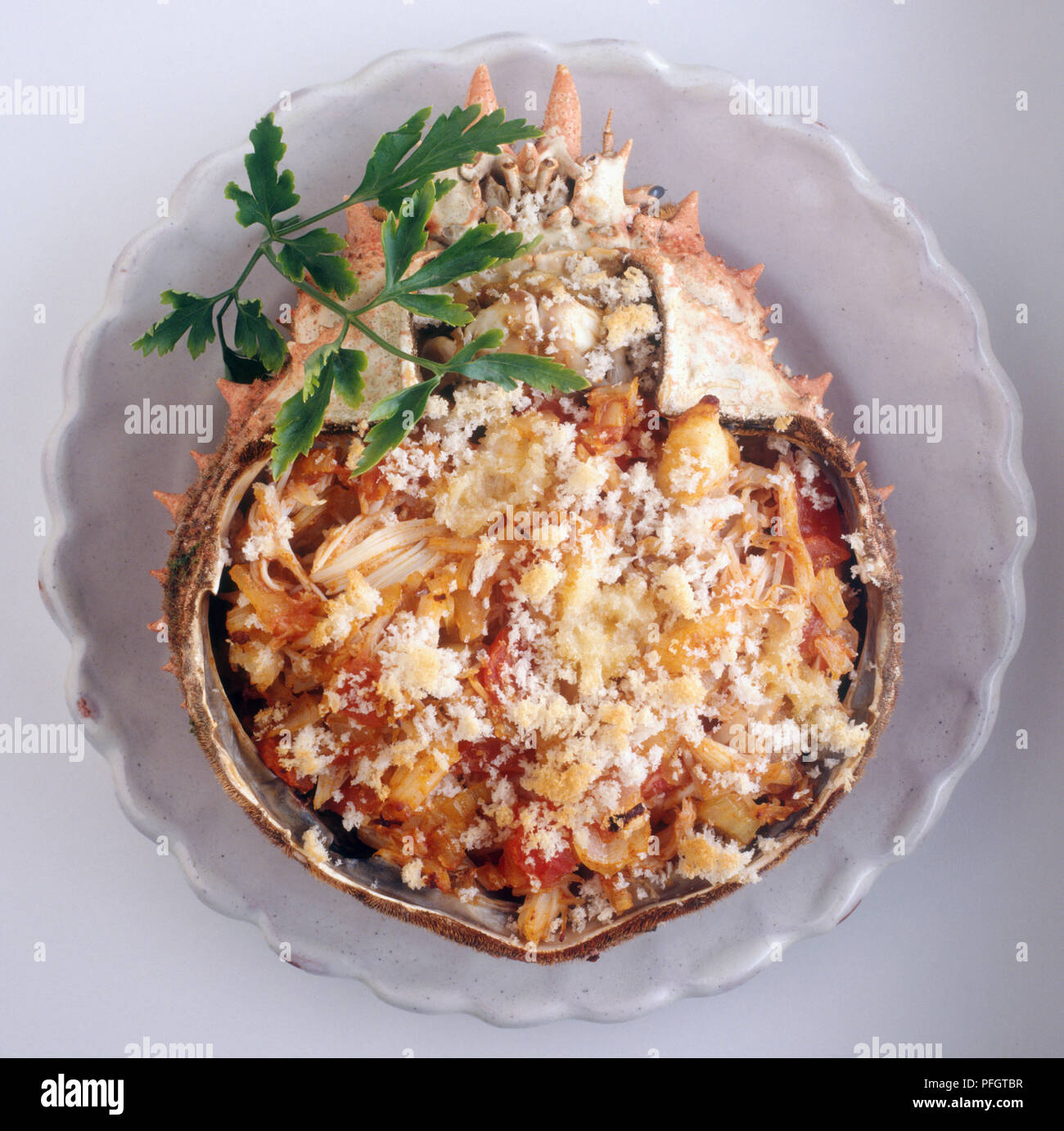 Bowl of Suquet, fish and shellfish stew seasoned with saffron, a ...