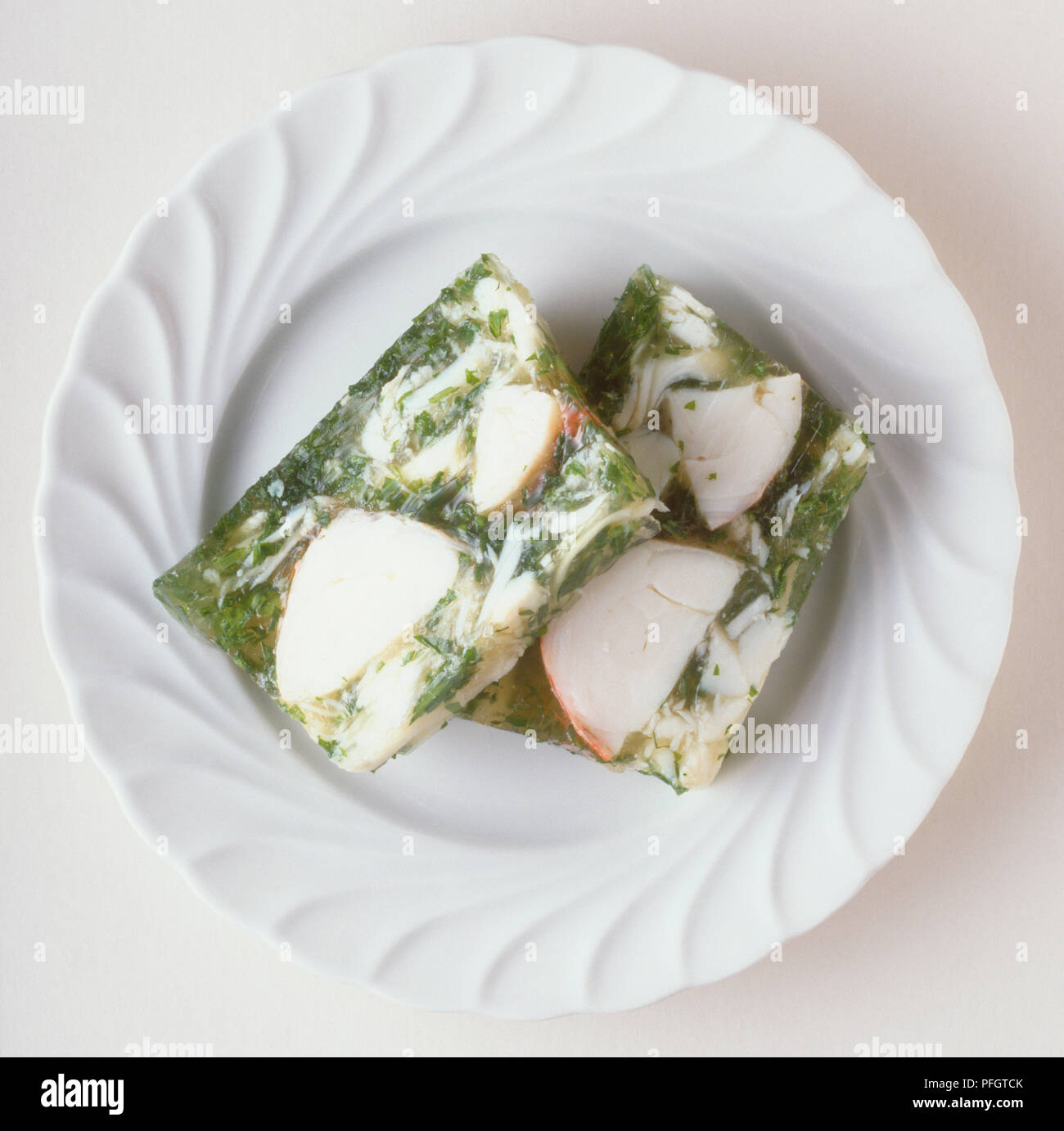 Two slices of Homard persille, lobster terrine with herbs, a typical ...