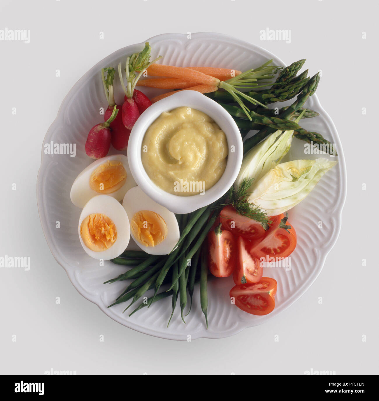 Plate of crudites, boiled eggs and a bowl of Aioli sauce, view from ...