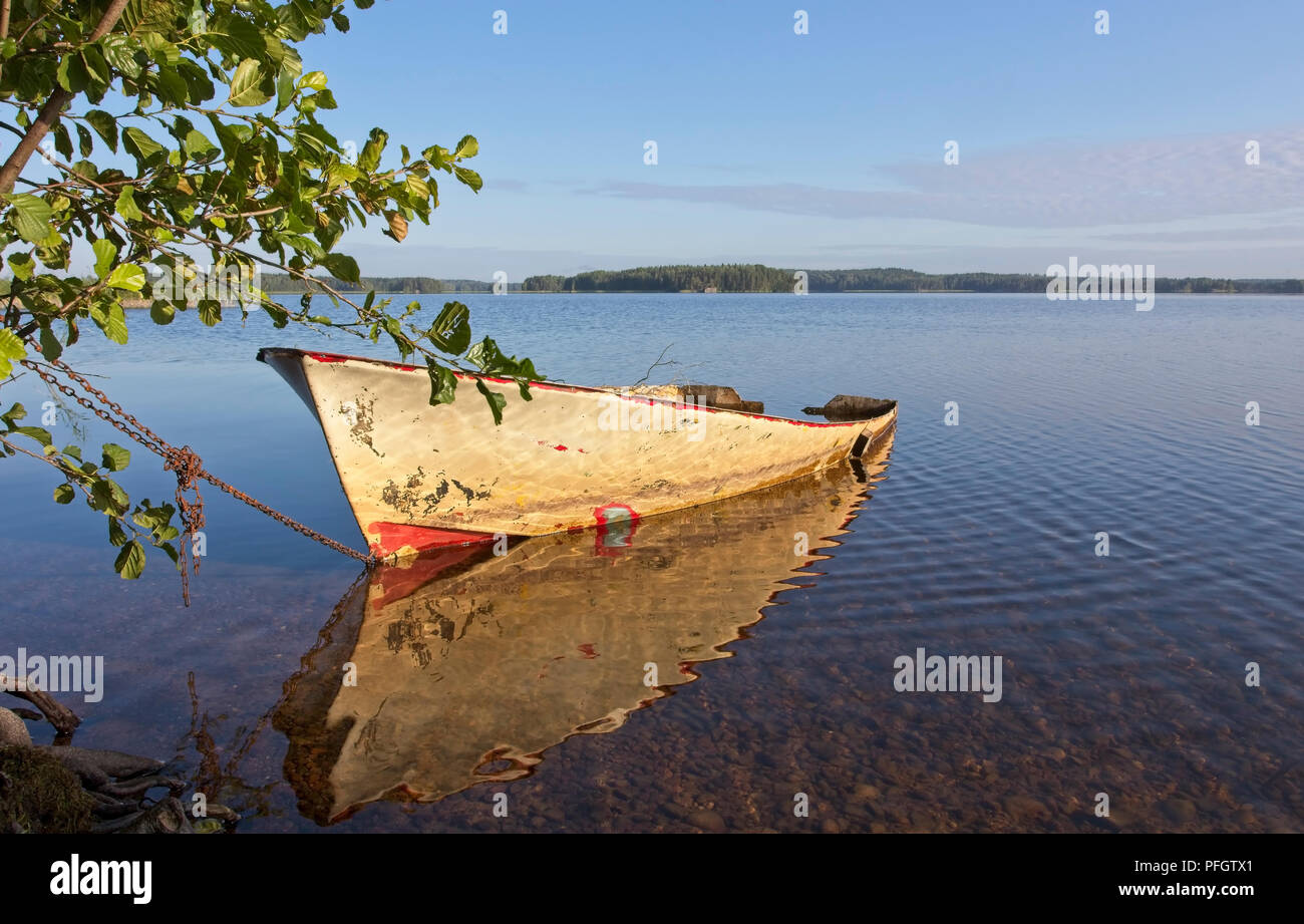 small boat filled with water, Finland Stock Photo - Alamy