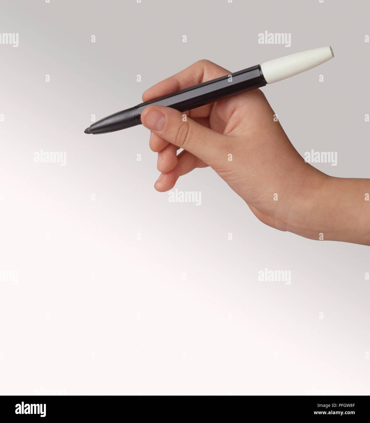 Child's hand holding felt-tip pen, close-up Stock Photo - Alamy