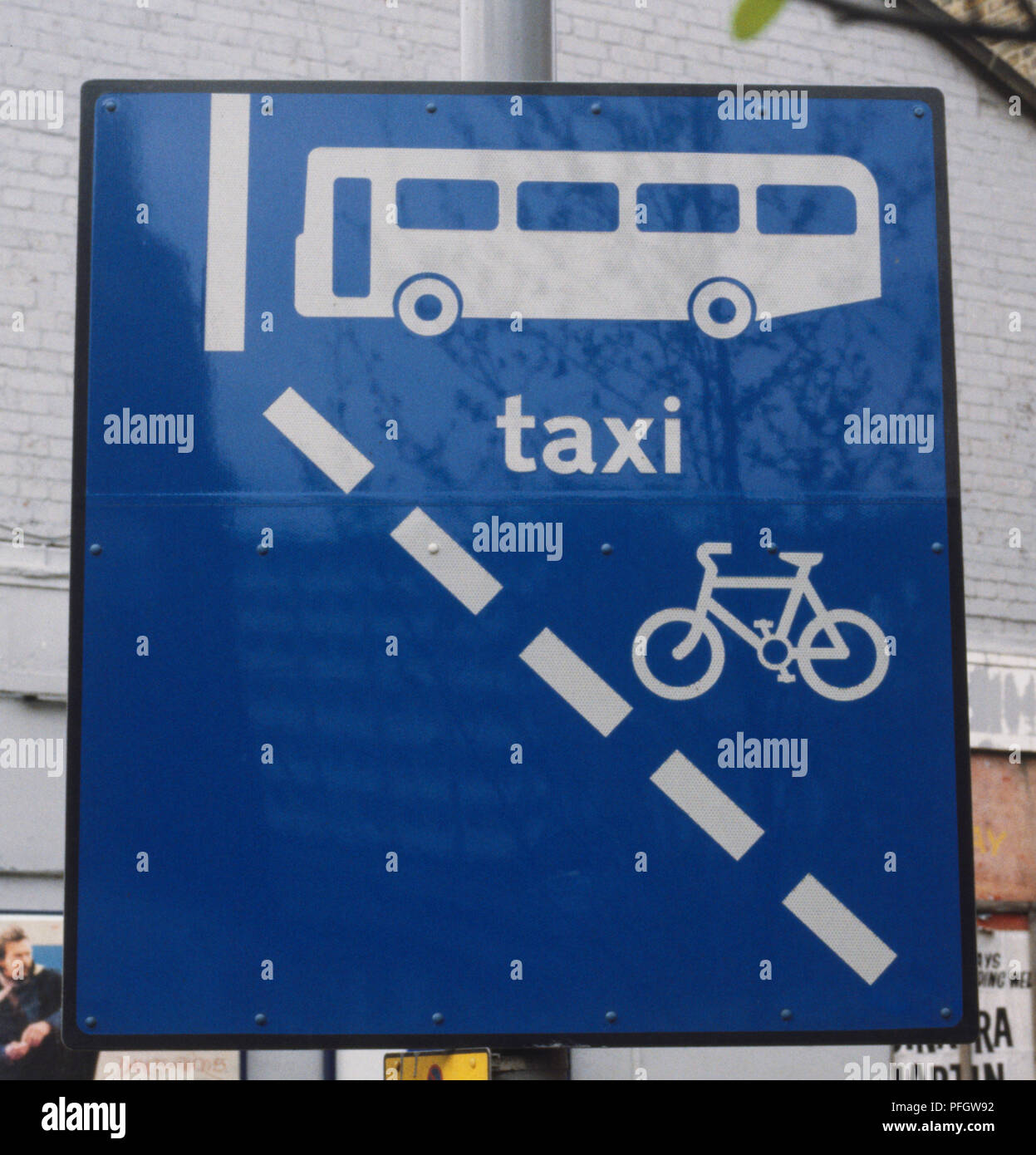 Road sign showing the restriction of a lane to buses, taxis, and ...