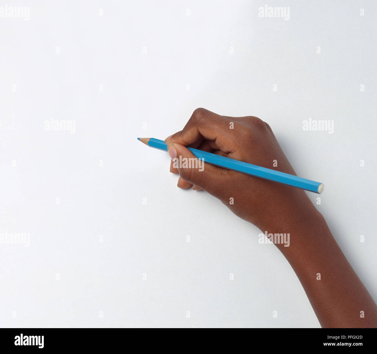 Child holding pale blue crayon Stock Photo - Alamy