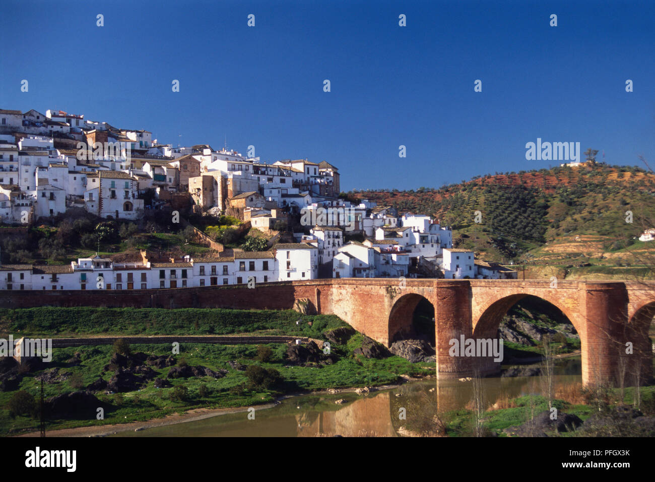 Spain, Andalusia, sixteenth century arched stone bridge spanning ...