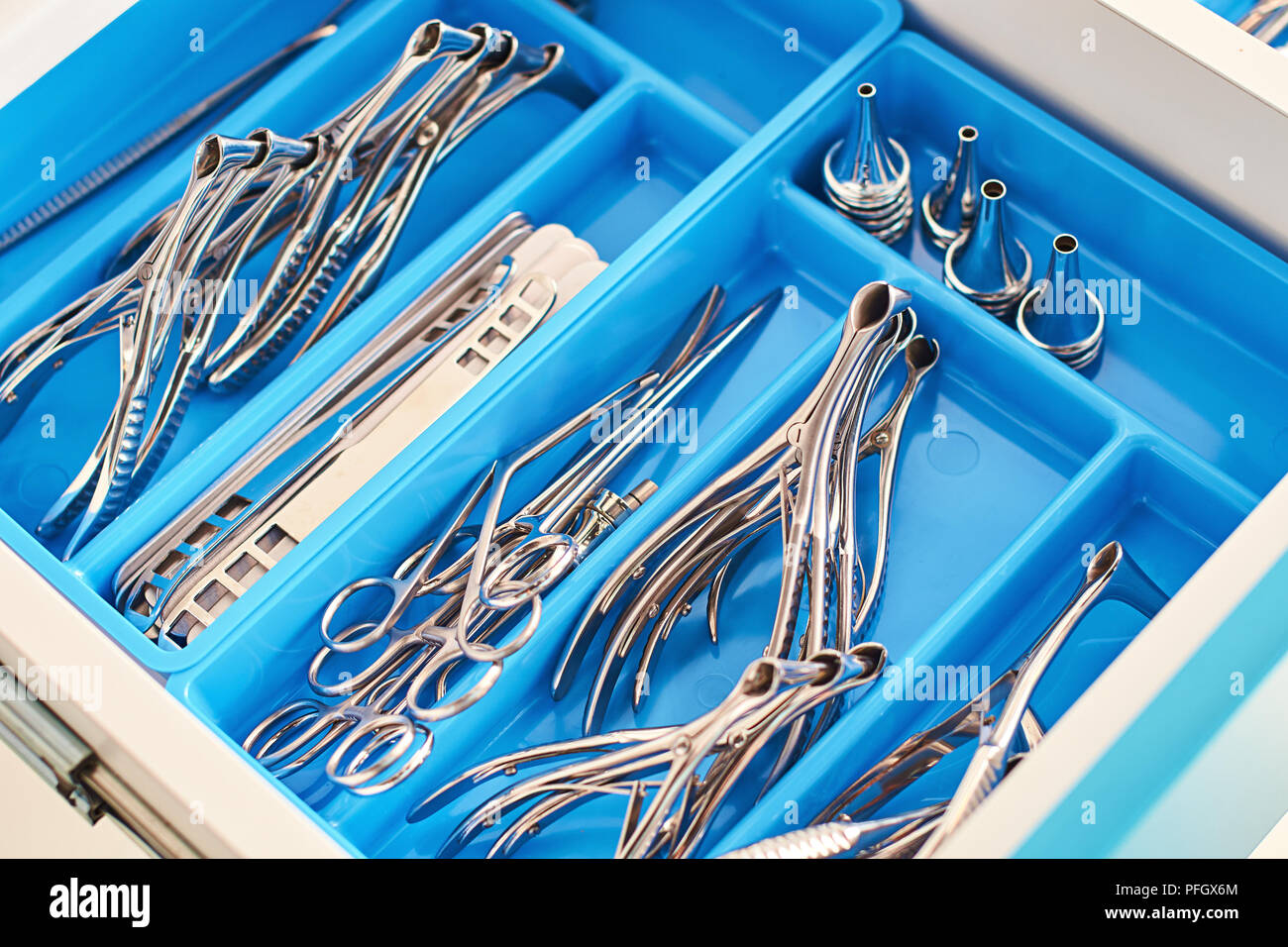 Otorhinolaryngology or ENT surgery instruments in a blue medical box ...