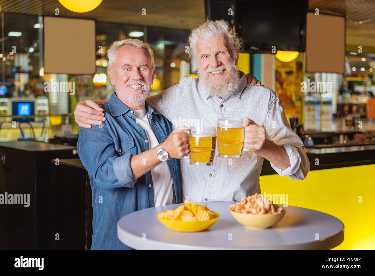 Happy nice aged men looking at you Stock Photo - Alamy
