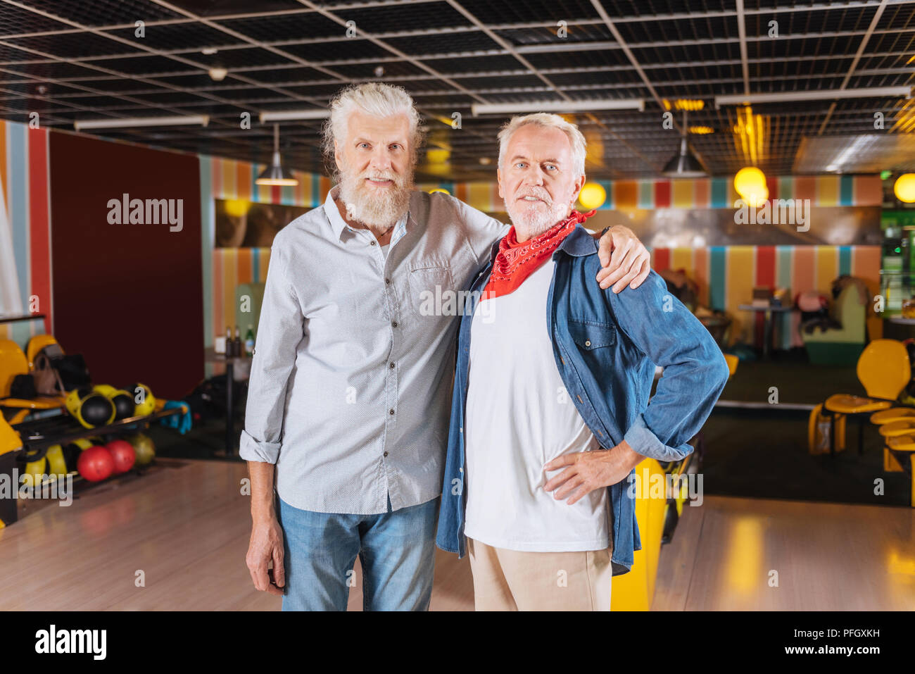Joyful positive aged man hugging his friend Stock Photo - Alamy Joyful positive aged man hugging his friend Stock Photo - Alamy