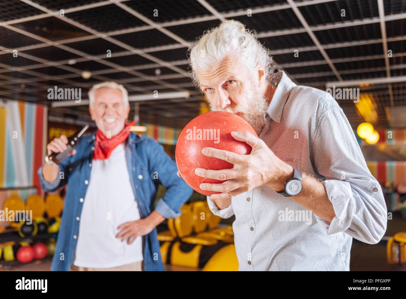 Serious aged man kissing the bowling ball Stock Photo - Alamy