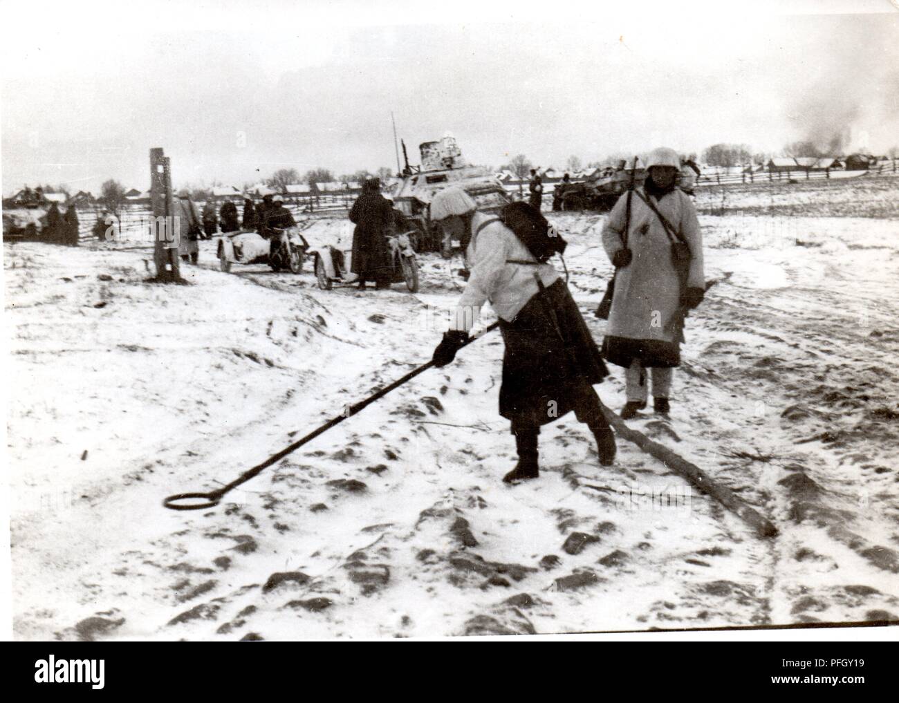 German Soldiers in snow Camouflage with a Mine detector in the winter ...