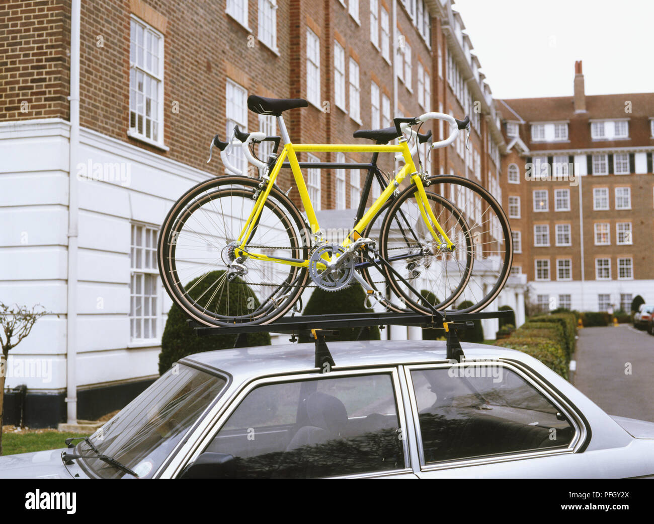 Two bikes being carried on mounted carrier on top of car Stock Photo ...