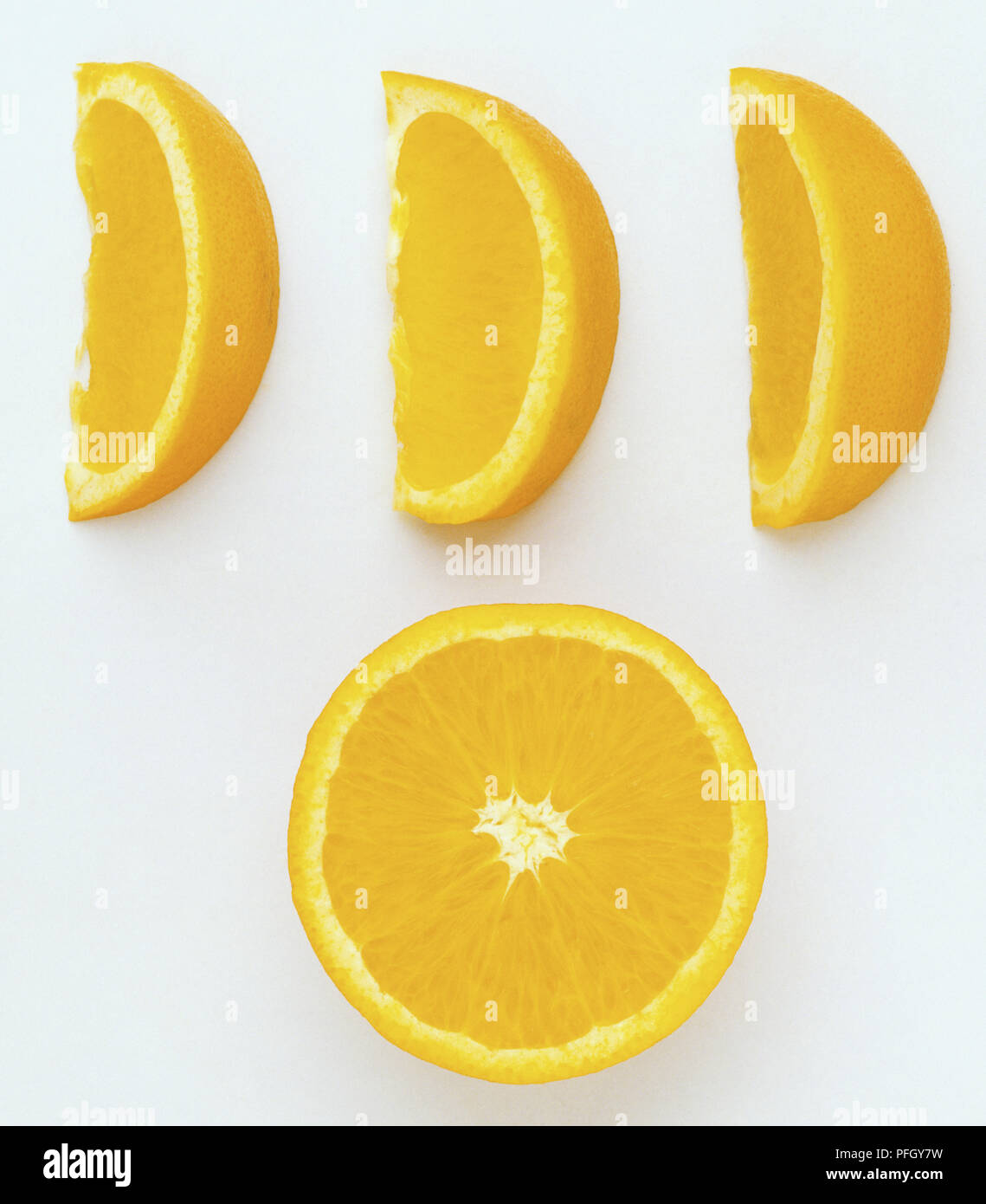 An orange cut in half and three segments Stock Photo - Alamy