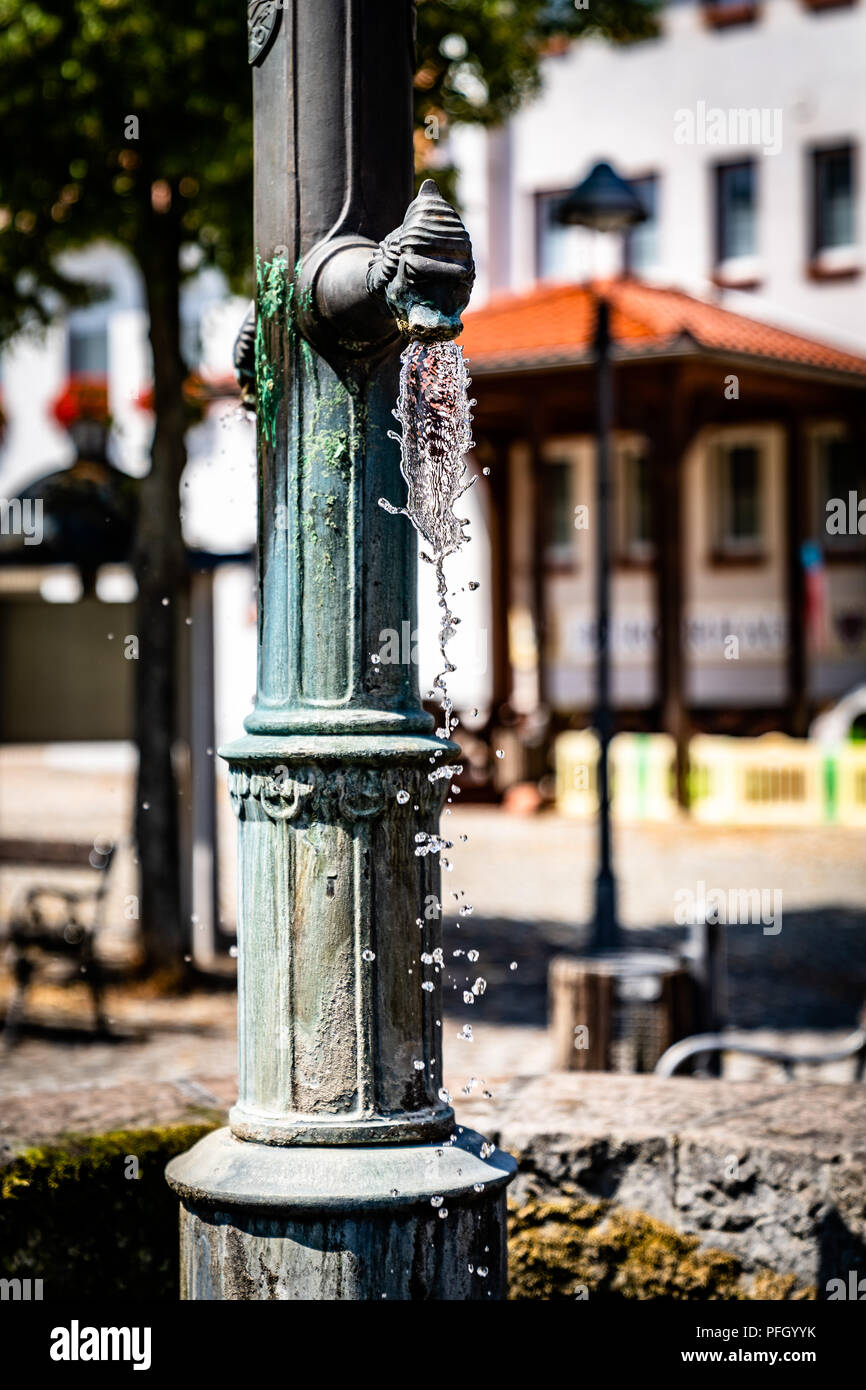 Traditional water fountain in garden Stock Photo - Alamy